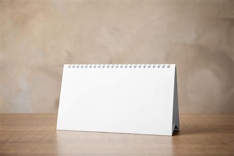 Premium Photo Blank Desk Calendar On Table Mockup For Design