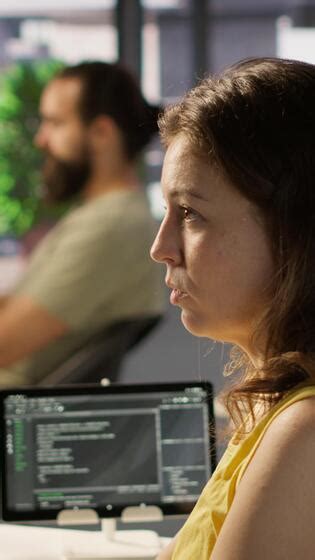 Vertical System Administrator At Work Doing Debugging Of Ai Software Using Pc Checking Glitches