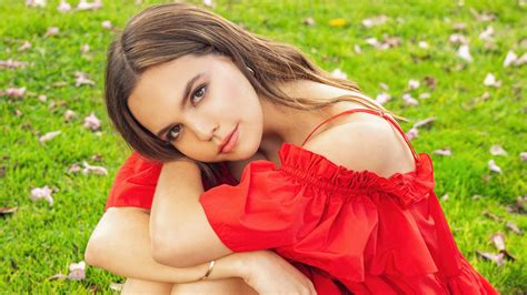 Bailee Madison Is Wearing Red Dress Sitting In Green Grass Field 4K HD Girls Wallpapers HD