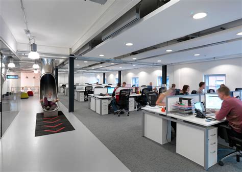 The Workshop Offices By Guy Hollaway Feature A Tubular Steel Slide