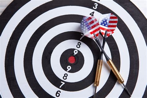 Premium Photo Dart Arrow Hitting In The Target Center Of Dartboard