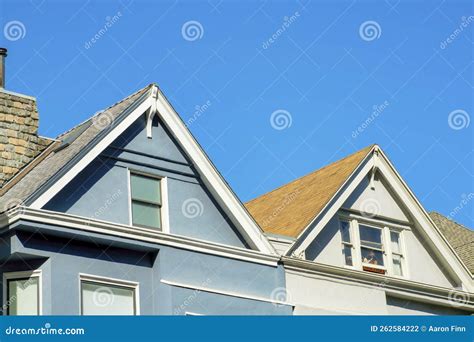 Row Of Modern Roofs On Two Seperate Houses One White And Blue With