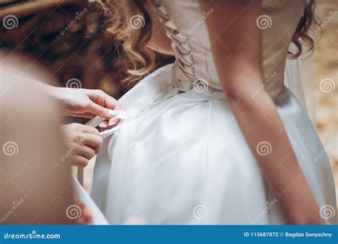 Bridesmaids Dressing Bride In The Morning In Hotel Room Girls Stock