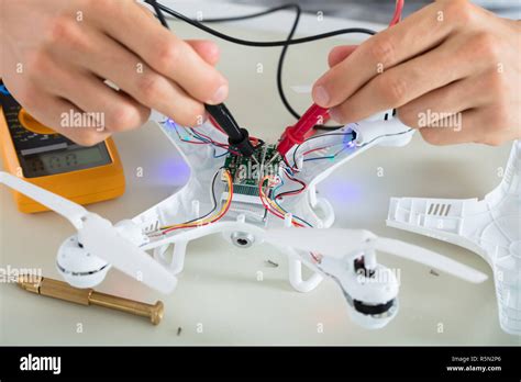 Man Testing Electric Current Of Drone Using Multimeter Tool Stock Photo Alamy