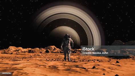 우주복을 입은 용감한 우주비행사들이 화성에서 토성까지 자신있게 걷고 있는 후 바위로 뒤덮인 외계인 붉은 행성 화성에 첫 번째 우주 비행사 첨단 기술 우주 탐사 여행 식민지