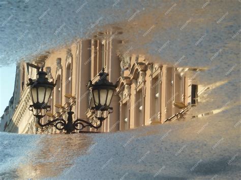 Premium Photo Two Street Lamps Reflection In Pond