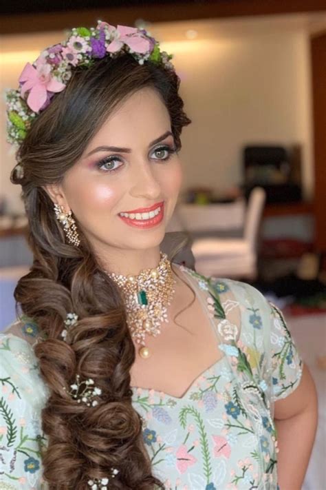 Indian Wedding Hairstyle With Curly Side Braid And Floral Tiara
