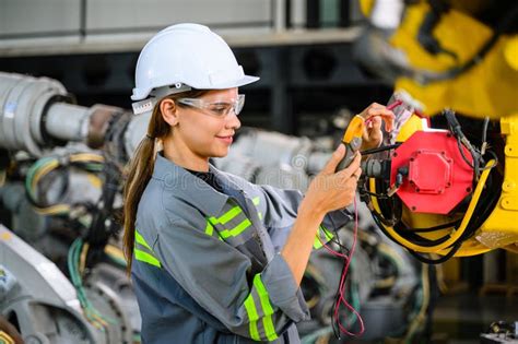 Female Engineer Worker Working With Robotic Machine Automation Stock