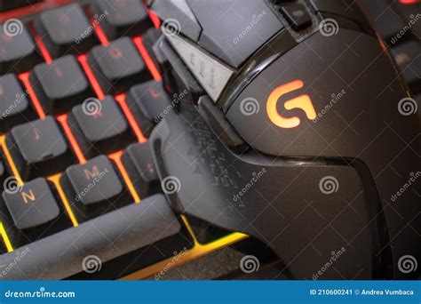 Logitech G Hero Gaming Mouse On Red Illuminated Gaming Keyboard Close Up Shot Devices To