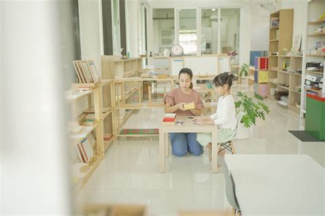 Elementary Girl Counting Color Bead Chain To Learn Mathematics With