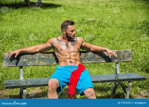 Muscular Shirtless Hunk Man Outdoor In City Park Royalty Free Stock