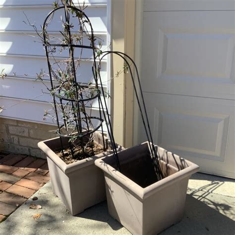 O673 Two Plastic Square Planters With Trellis