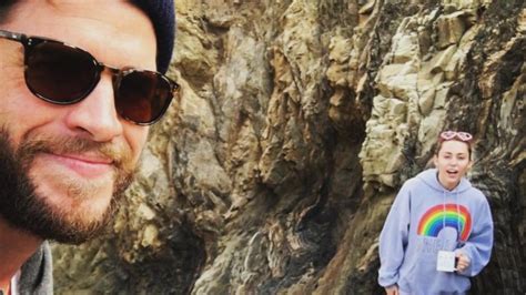 Miley Cyrus Shares A Sexy Photo Of Liam Hemsworth In A Wetsuit During