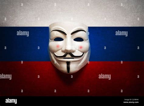 Hacker Mask On A Computer Screen With The Background Of The Russian Flag Cyber Attack Concept