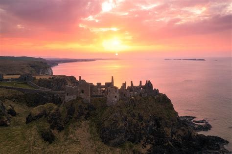 Sunset Over Dunluce Castle Northern Ireland 🌅 R Castles