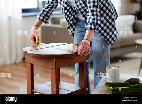 Woman With Ruler Measuring Table For Renovation Stock Photo Alamy