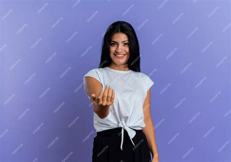 Free Photo Smiling Young Caucasian Girl Gestures Come Here Hand Sign