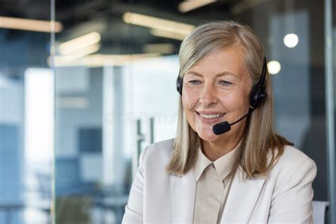 Close-up Photo of a Senior Business Woman Sitting in the Office and ...