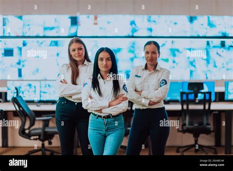 Group Portrait Of Female Security Operator While Working In A Data System Control Room Offices
