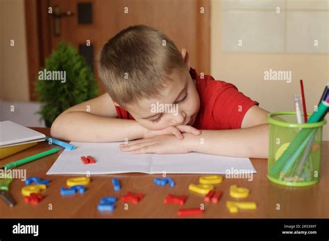 Preteen Boy Lying Himself On The Table Taking Power Nap While Study And Preparing Himself For