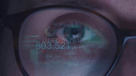 Glasses And Eyes Of Girl Working At A Computer Reflection Of The
