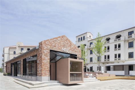 BLUE Architecture Adds Rectangular Cafe To Red Brick Building In China