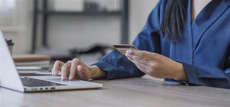 Close Up Attractive Millennia Asian Female Holding Her Smartphone And Credit Card Using Mobile