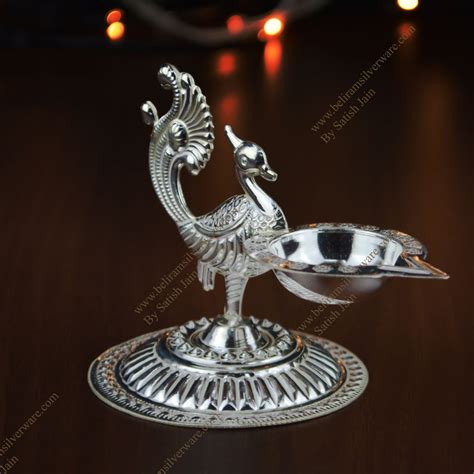 Glossy Finish Peacock Silver Diya On Stand Beliram Silverware