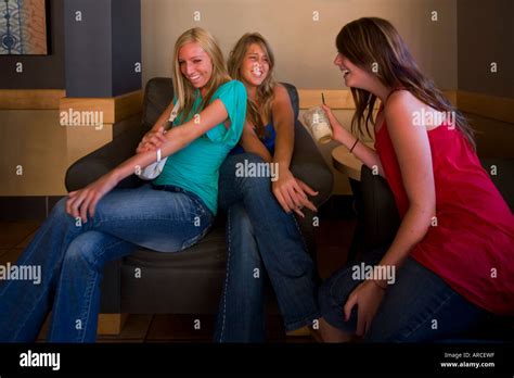 Three Teen Girls Have A Laughing Conversation In A Southern California