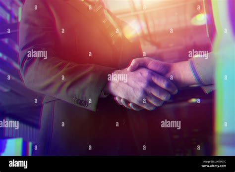 Handshaking Of Business Person In Office As Teamwork And Partnership