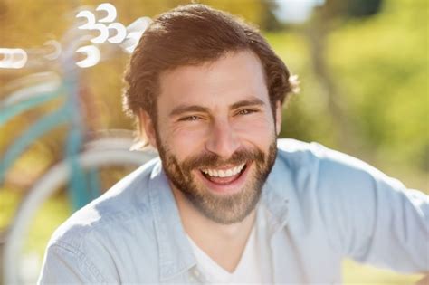 Premium Photo Portrait Of Handsome Man Smiling At Camera