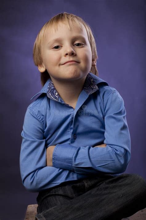 Babe In A Blue Shirt And Black Trousers On Purple Background Stock Photo Image Of Smiling Blue