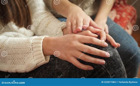 Closeup Of Teenage Girl Stroking Her Friendand X27s Hands Friends