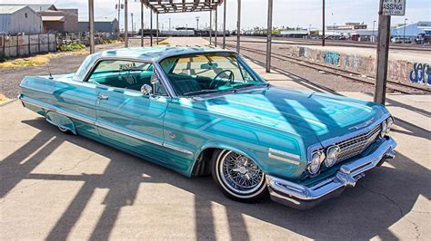 Vintage Blue Car Parked By Train Station Blue Lowrider Car Style