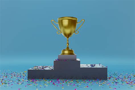 연단 위에는 금잔이 놓여 있고 그 주위에는 색종이 조각이 있습니다 1위에 대한 스톡 사진 및 기타 이미지 1위 3차원 형태