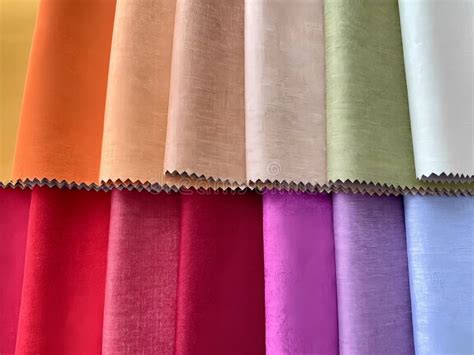 Vibrant Stack Of Fabric Swatches For Fashion And Textile Marketing