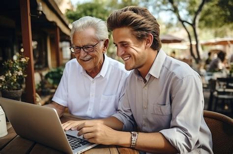 Premium Ai Image An Adult Son And His Father Teaches To Use A Laptop