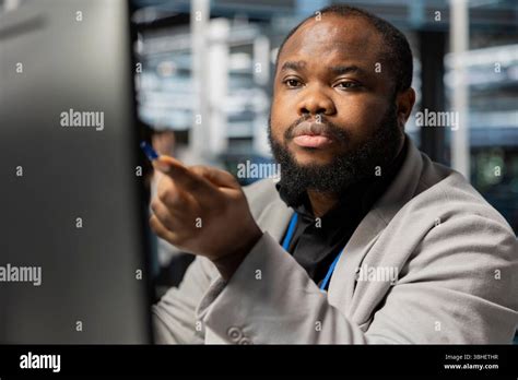 Data Center Computer Scientist Inspecting Gear Doing Maintenance Tasks