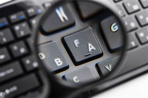 Free Photo Magnifying Glass On Black Keyboard