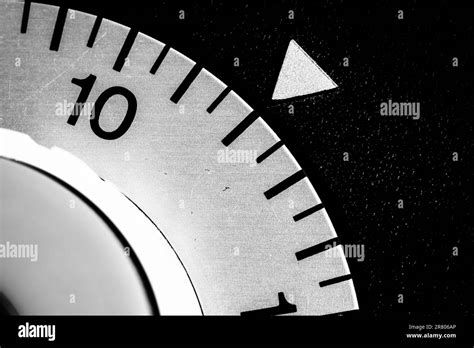 Monochrome Close Up Of An Analog Laboratory Timer Set To Twelve Stock