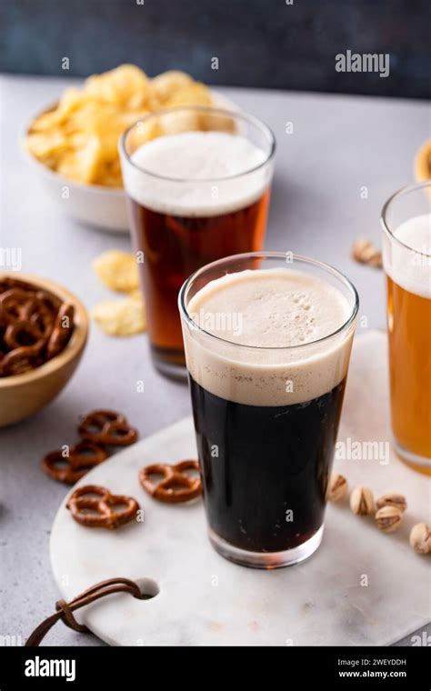Dark Stout Lager And Ale Beer In Tall Glasses On The Table Variety Of