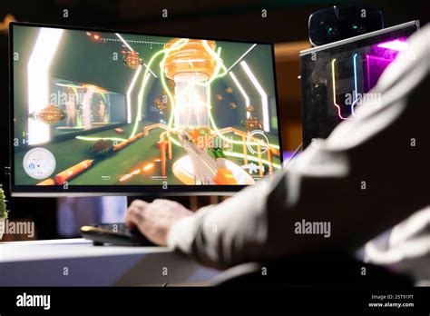 Man Enjoying Competitive Online FPS Videogame Battling Flying Robots With Futuristic Gun Close