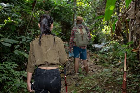 Free Photo Male And Female Tourists Are Enjoying The Forest