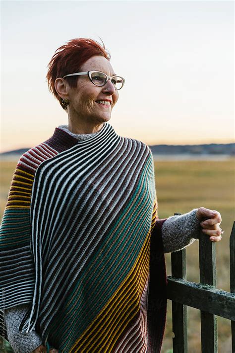 Standing Portrait Of Elegant Senior Woman Outdoors In Nature Landscape