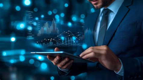 Professional Man Analyzing Data On A Tablet With Digital Graphs In A Modern Office Setting
