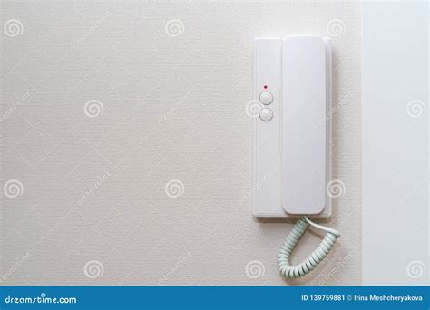 Close Up Old Intercom System In The Apartment Hanging On The White Wall At The Door Stock Image