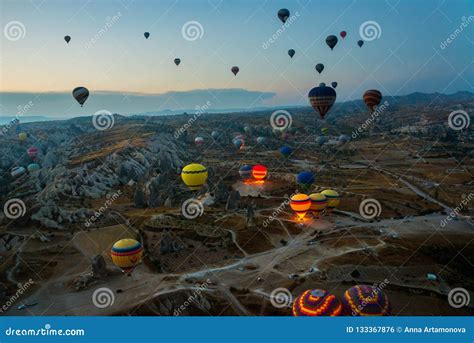 Cappadocia Turkey Hot Air Balloons Are Flying During Sunrise In