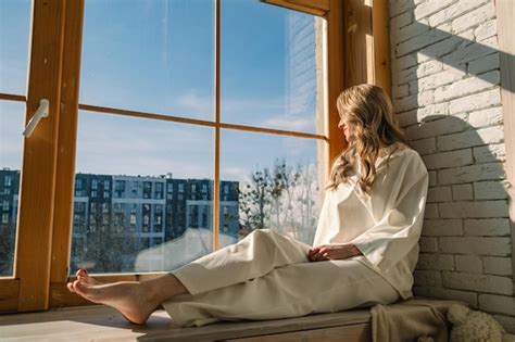 Premium Photo Beautiful Woman Near Window Highlighted With Bright Sun