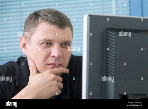 Mid Adult Man Using Computer Stock Photo Alamy
