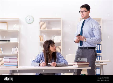Male Lecturer Giving Lecture To Female Babe Stock Photo Alamy